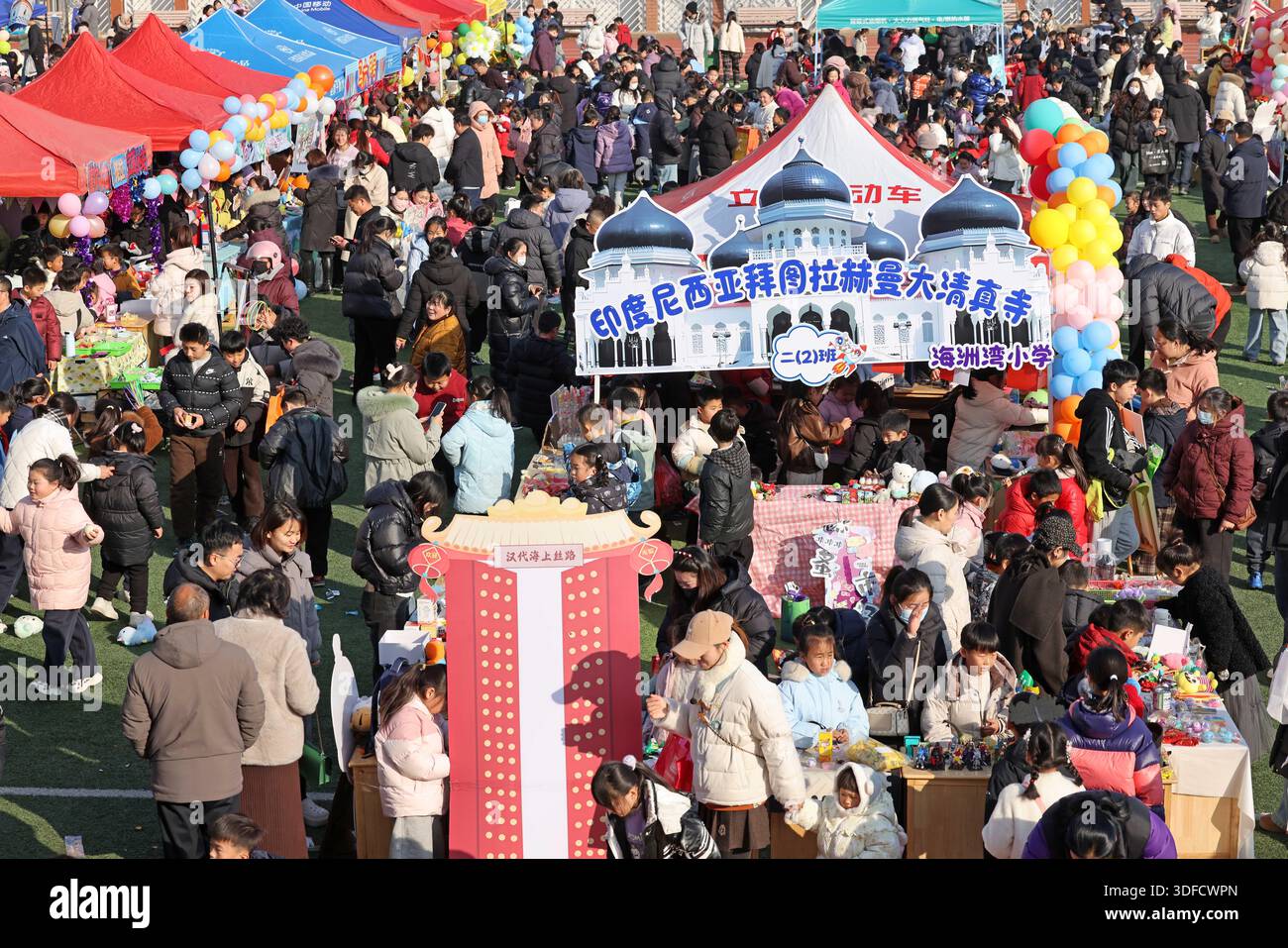 Students promote goods at a flea market event in Lianyungang City, east ...