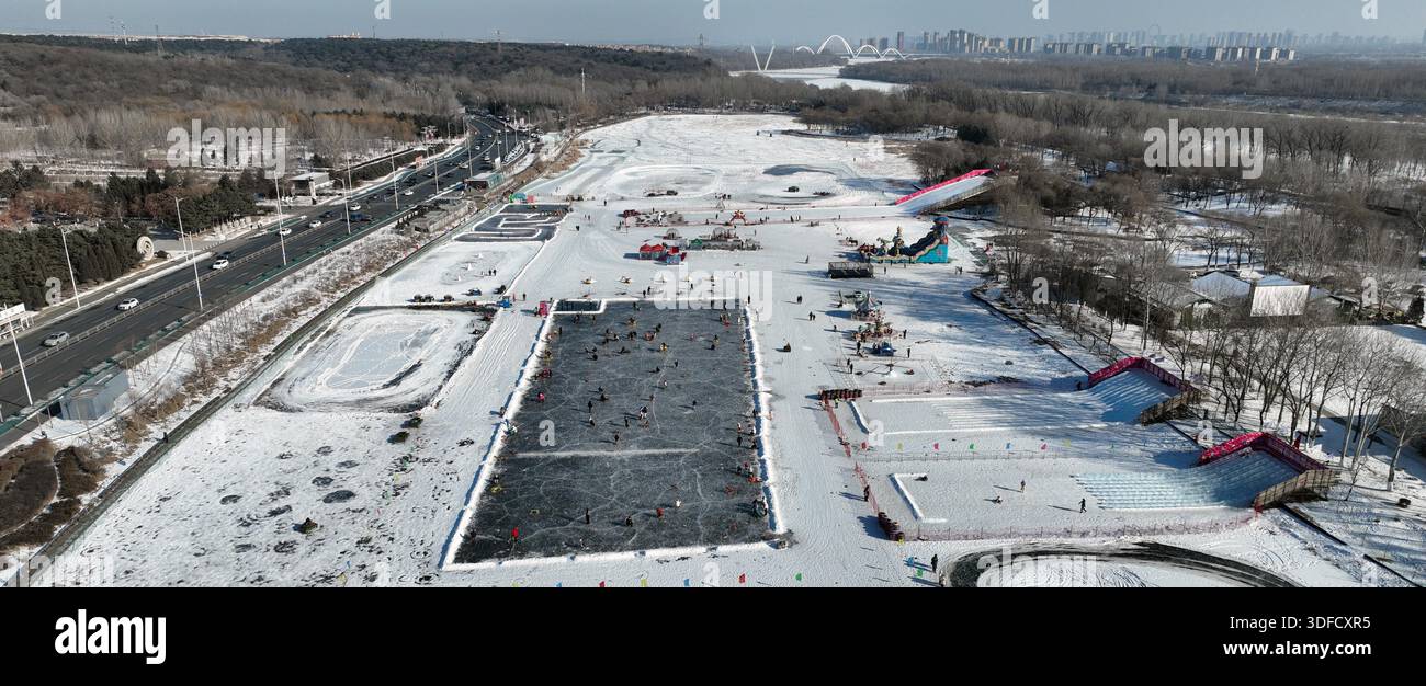 Aerial photo shows visitors enjoying ice and snow activities at ...