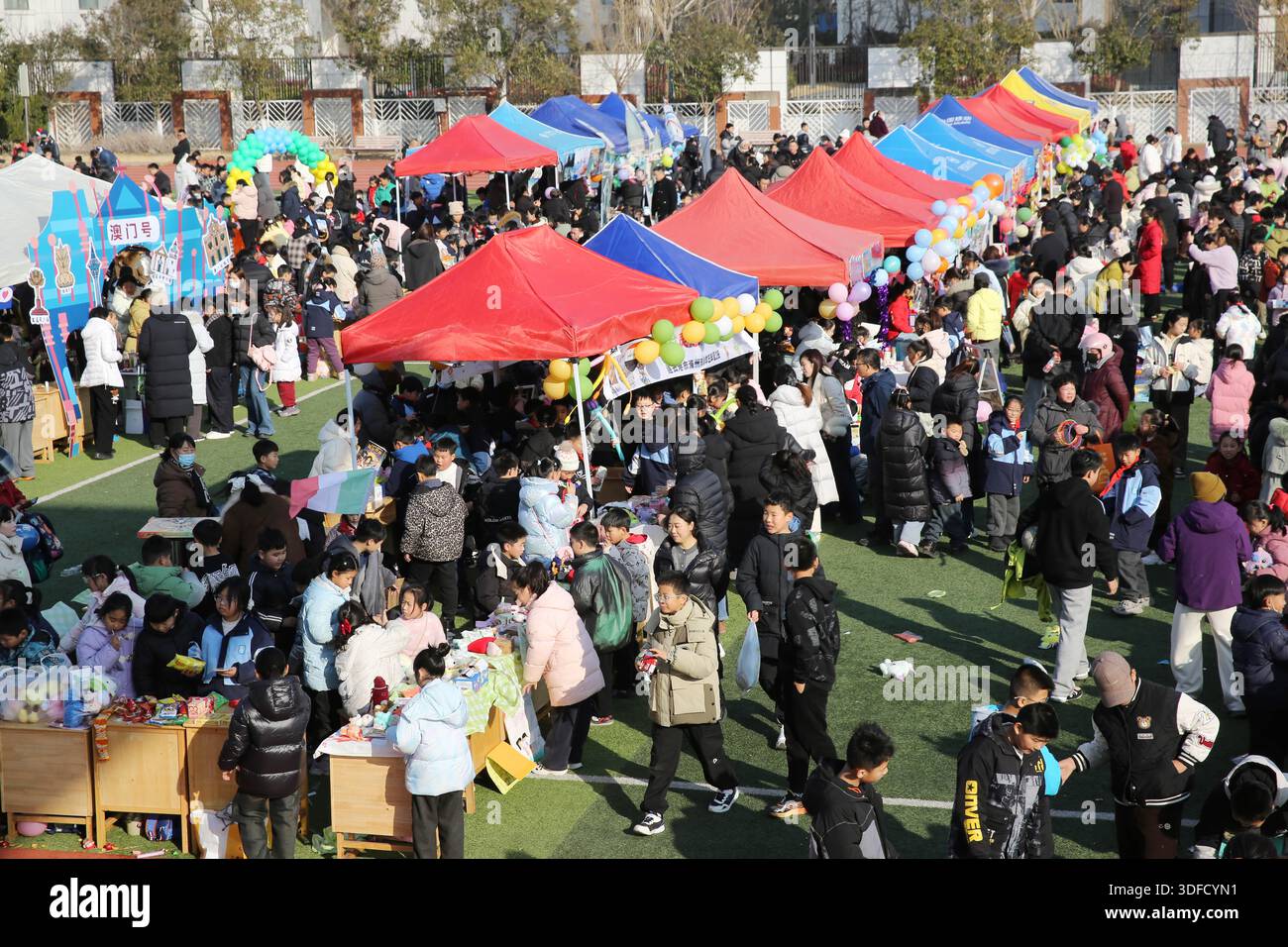 Students promote goods at a flea market event in Lianyungang City, east ...
