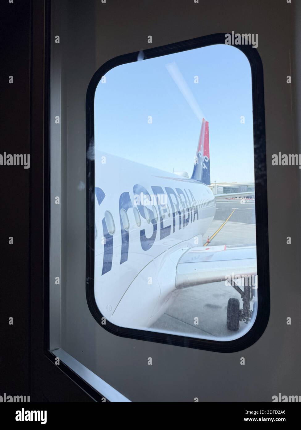 Passenger airplane seen through airport window frame. Aviation ...