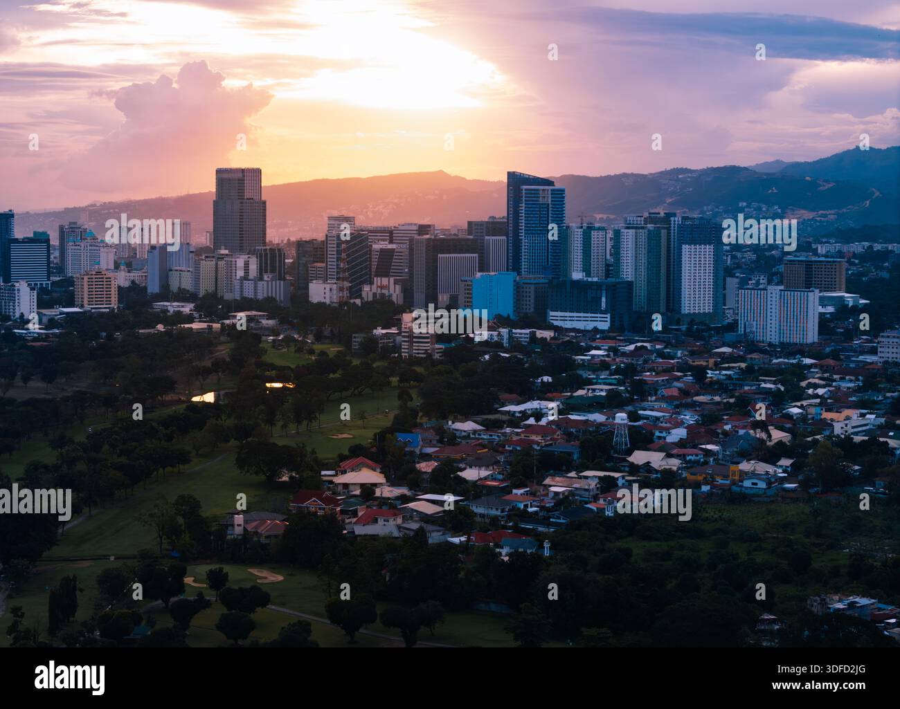 Aerial view of modern skyscrapers piercing the skyline as twilight ...