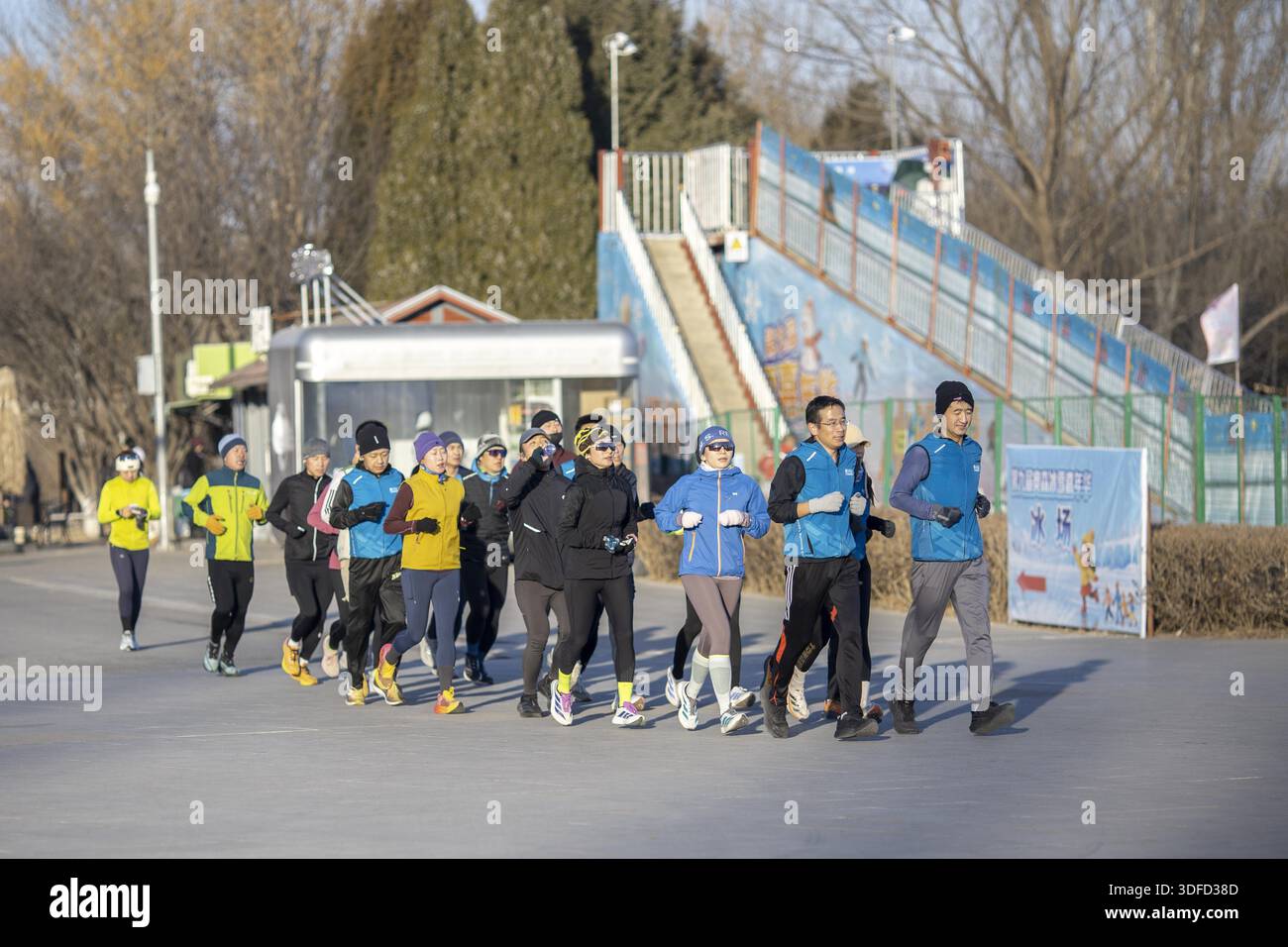 People jog in Olympic Forest Park in Beijing, China, 10 January, 2026 ...
