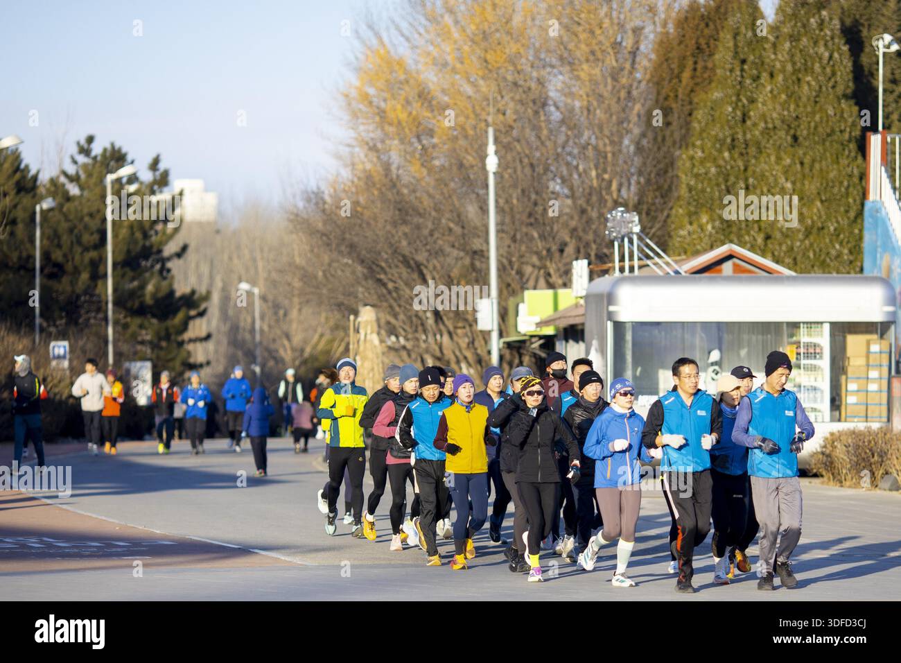 People jog in Olympic Forest Park in Beijing, China, 10 January, 2026 ...