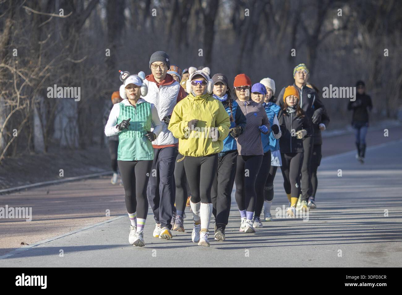 People jog in Olympic Forest Park in Beijing, China, 10 January, 2026 ...