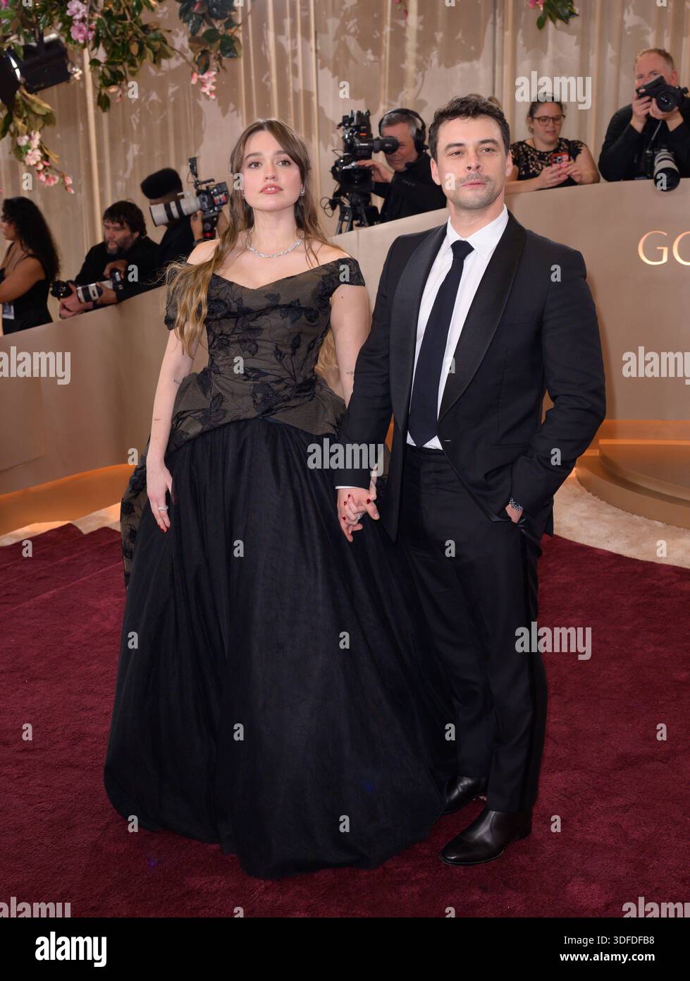LOS ANGELES, USA. January 11, 2026: Aimee Lou Wood & Adam Long at the ...
