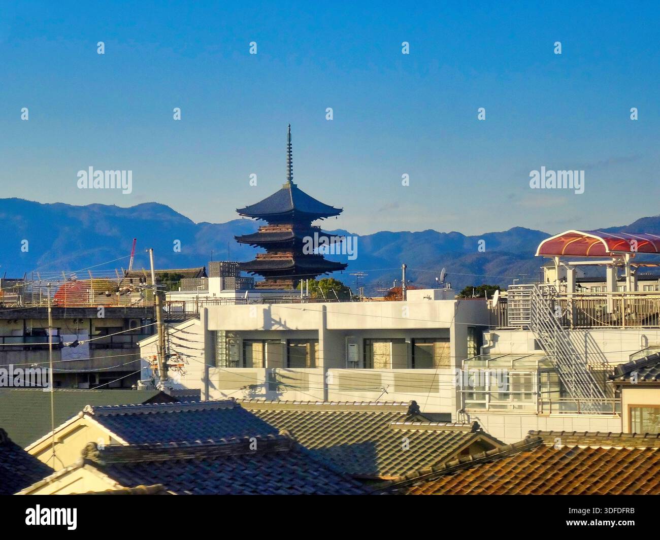 Historic Toji Temple Five-Storied Pagoda rising above the modern urban ...