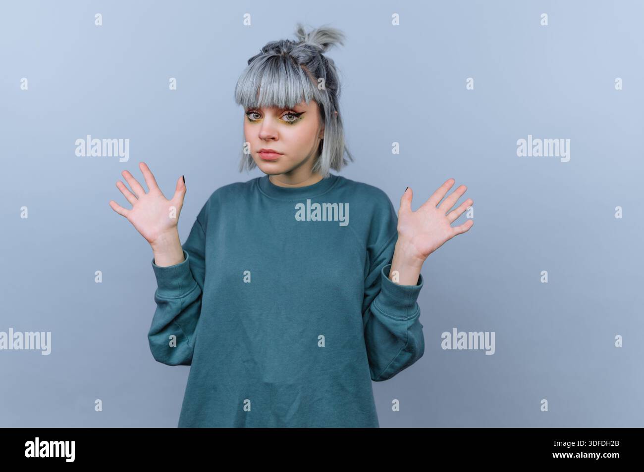 Woman wears gray sweater hi-res stock photography and images - Alamy