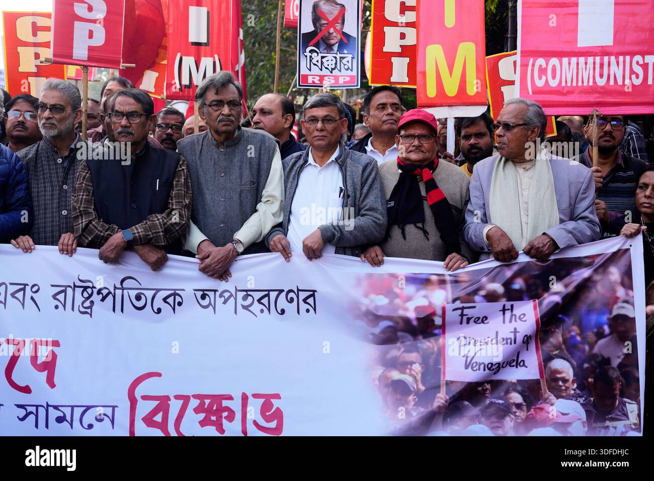 Leaders of the leftist parties lead a rally with posters and banners ...