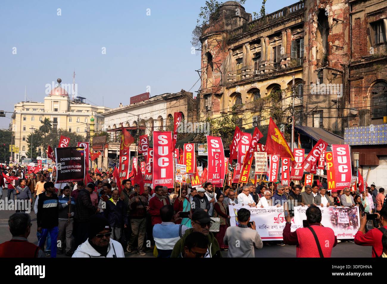Leaders and activists of leftist parties walk in a rally with posters ...