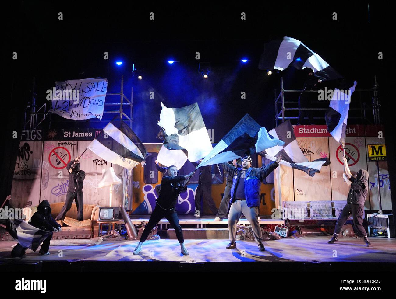 Members of the cast, including (centre, left to right) Dean Logan and ...