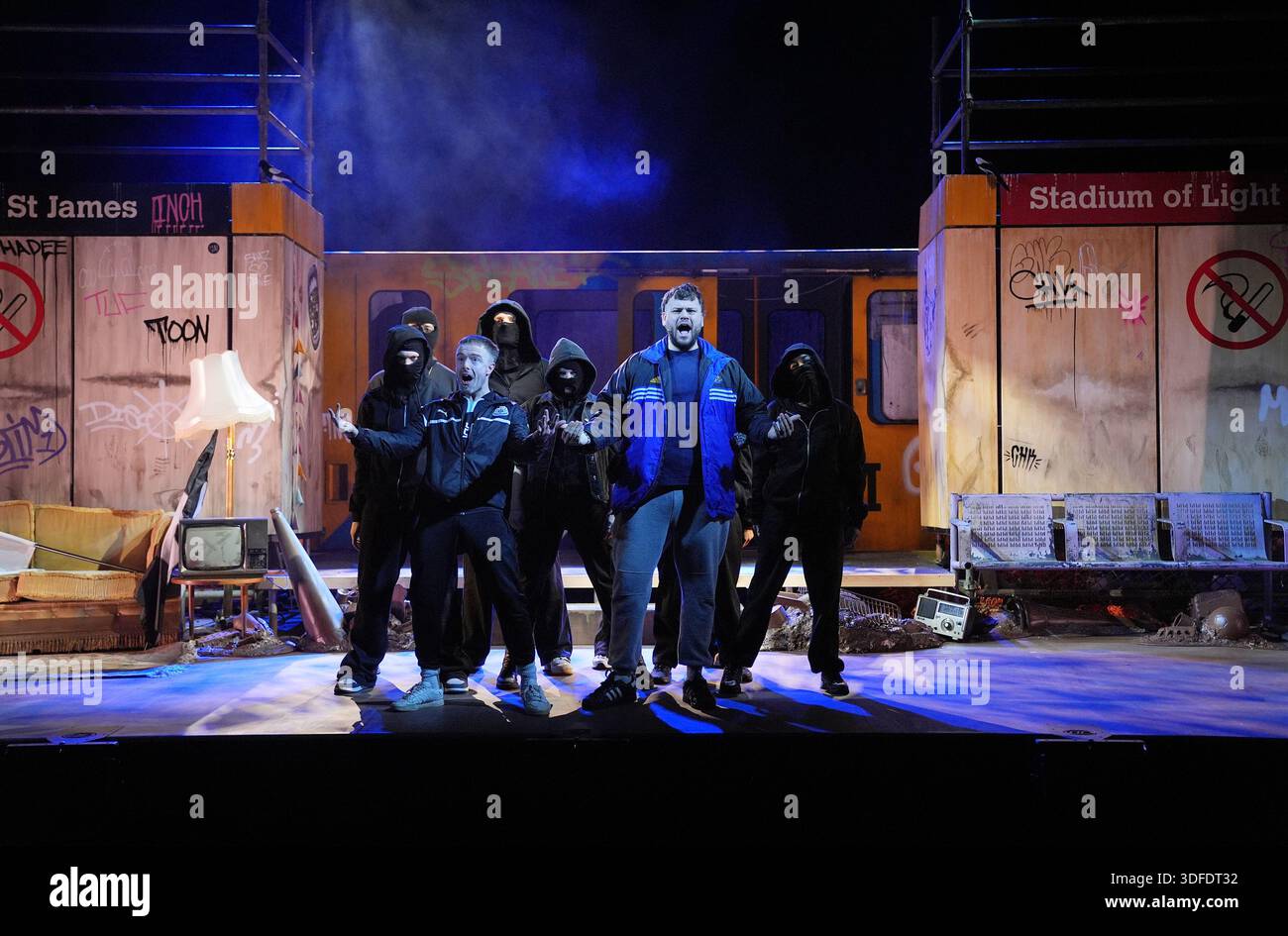 Members of the cast, including (centre, left to right) Dean Logan and ...