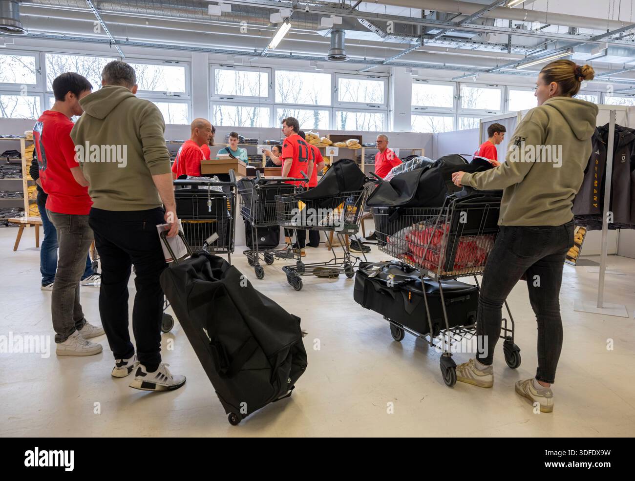 12 January 2026, Bavaria, Munich: Athletes stand at one of the ...