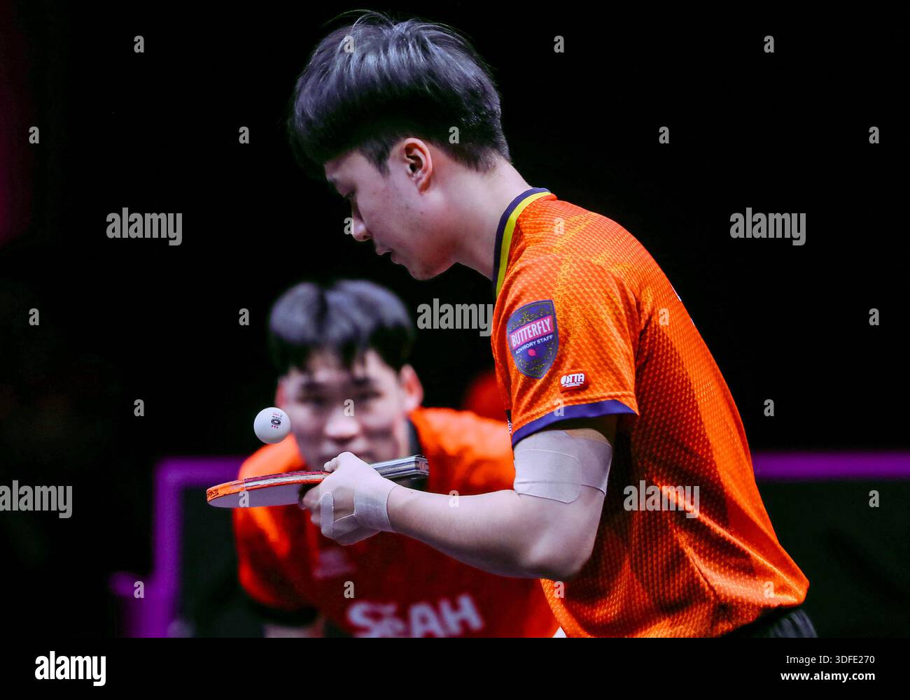 Lin Yun-ju, a player from Taiwan, returns a ball to Tomokazu Harimoto ...