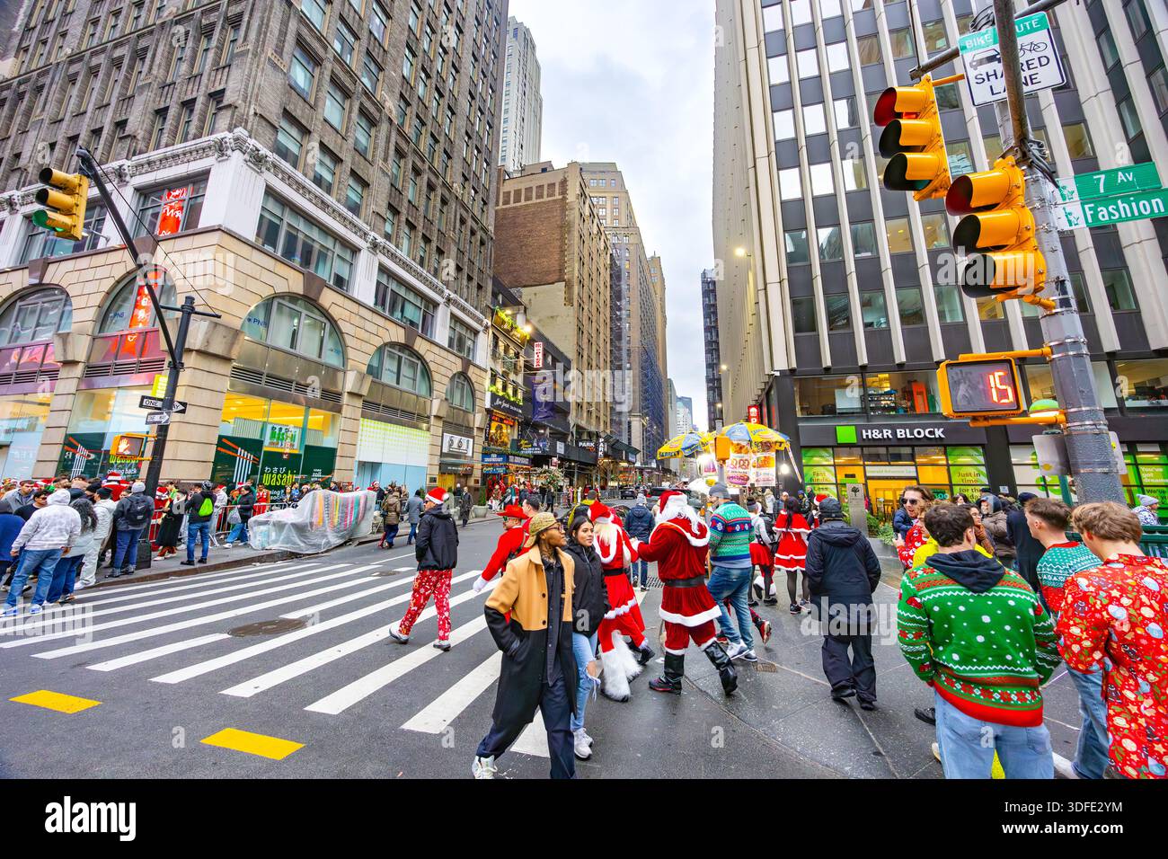 New-York, USA - 22.12.2025: People dressed as Santa Claus cross a city ...