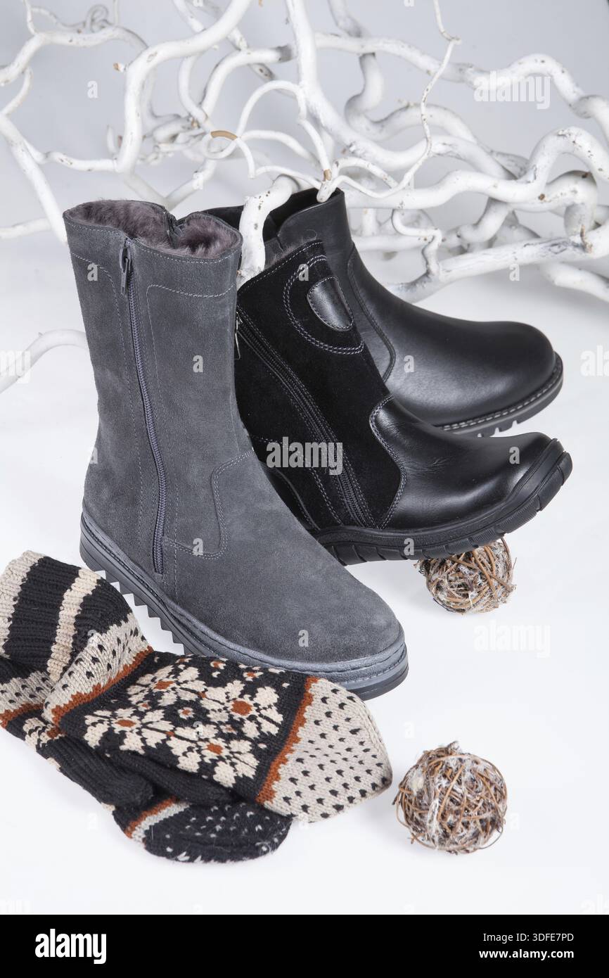 Different shoes on an isolated studio background Stock Photo - Alamy