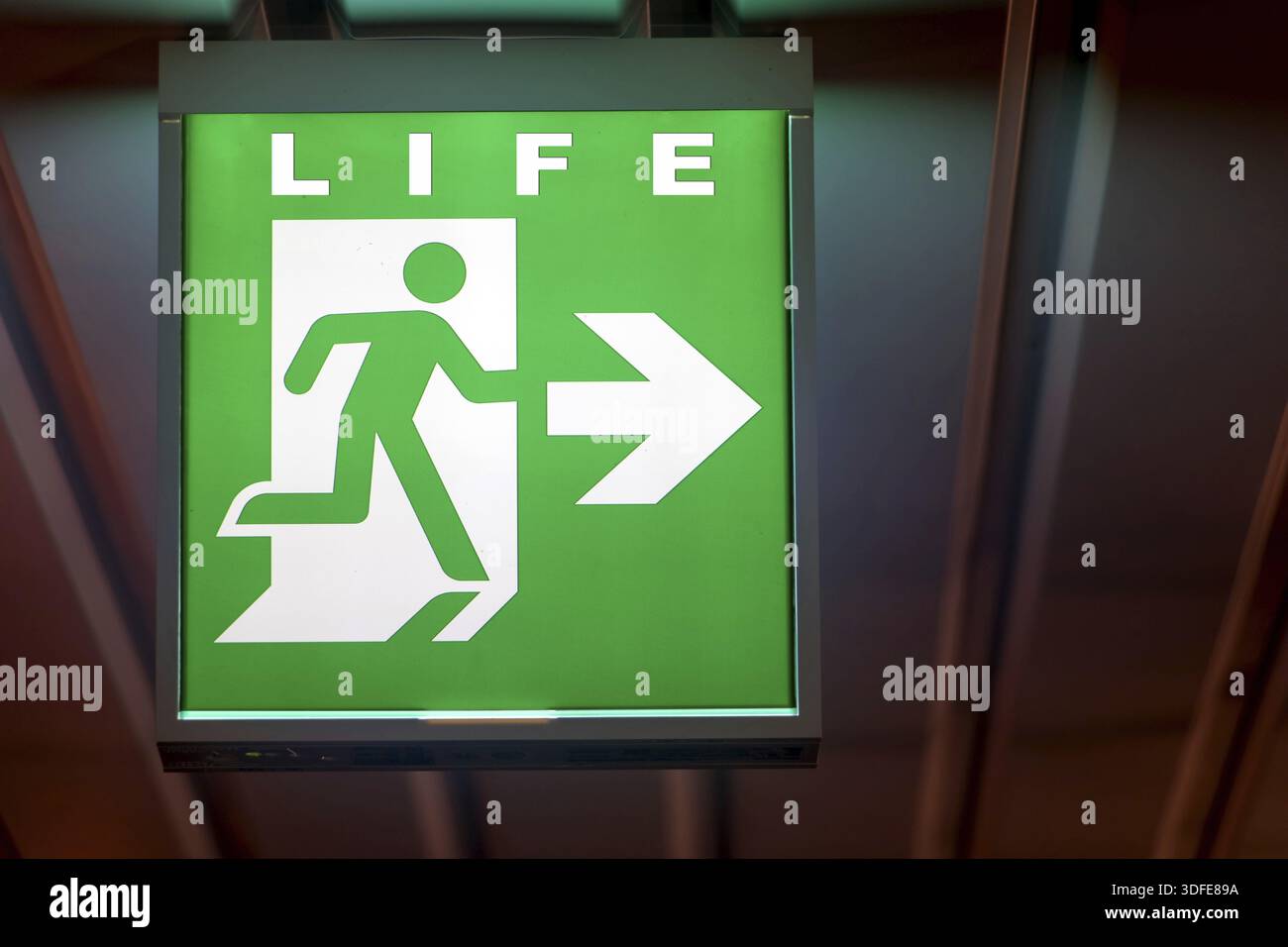 The emergency exit sign shows the direction of Life. The emergency exit ...