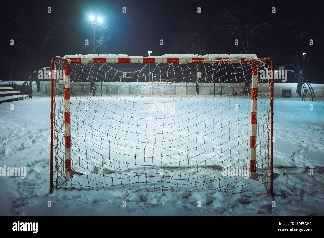 Soccer goal on the field, night scene during winter with lots of snow ...