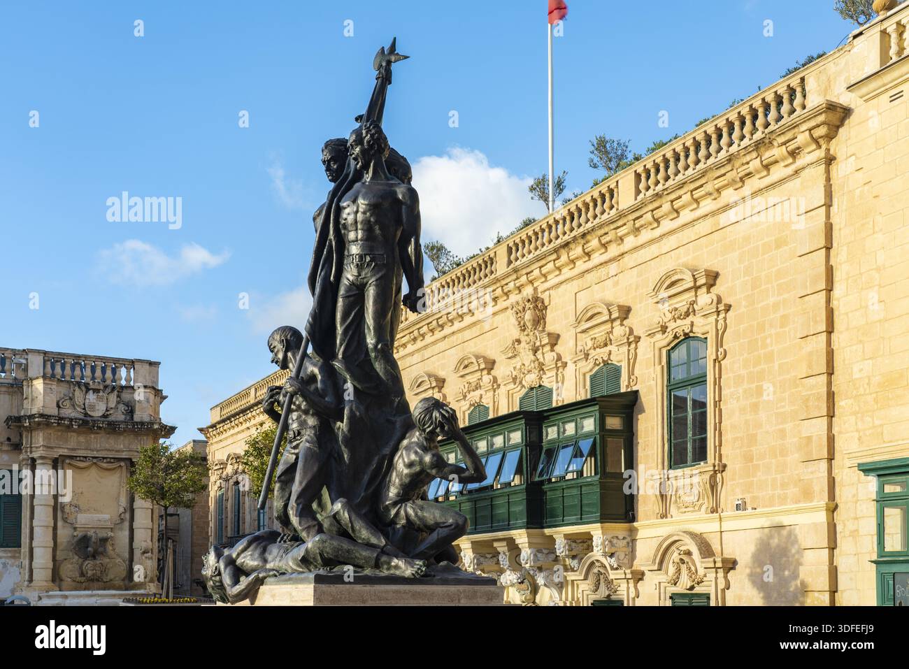 View of bronze monument depicting figures in dynamic poses stands ...