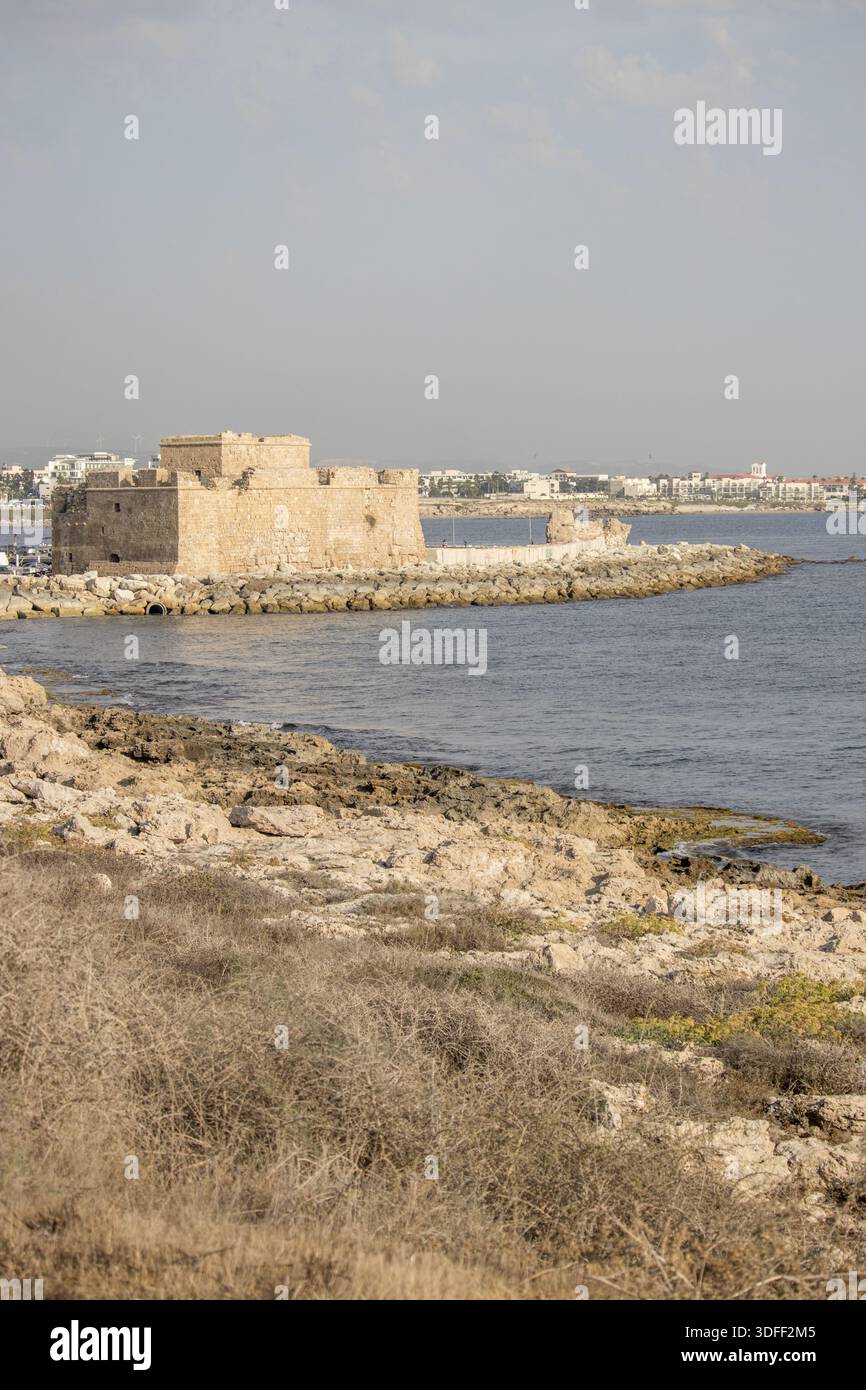 View of an old stone fortress standing defiant against the crashing ...
