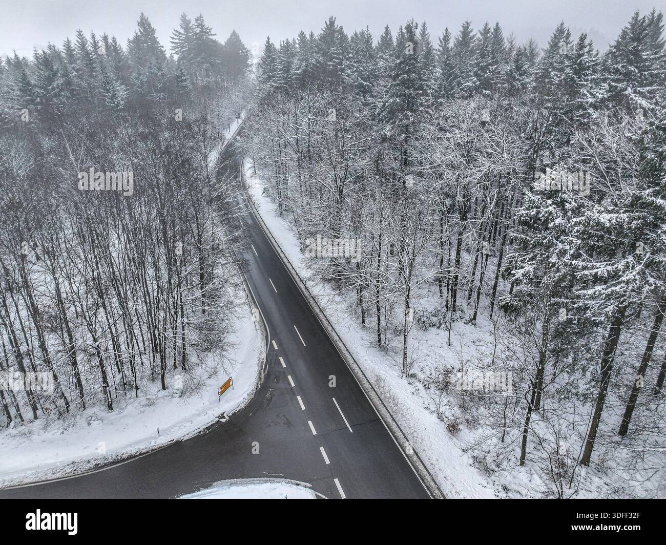 11 January 2026, Baden-Württemberg, Aalen: Snow-covered forests and ...