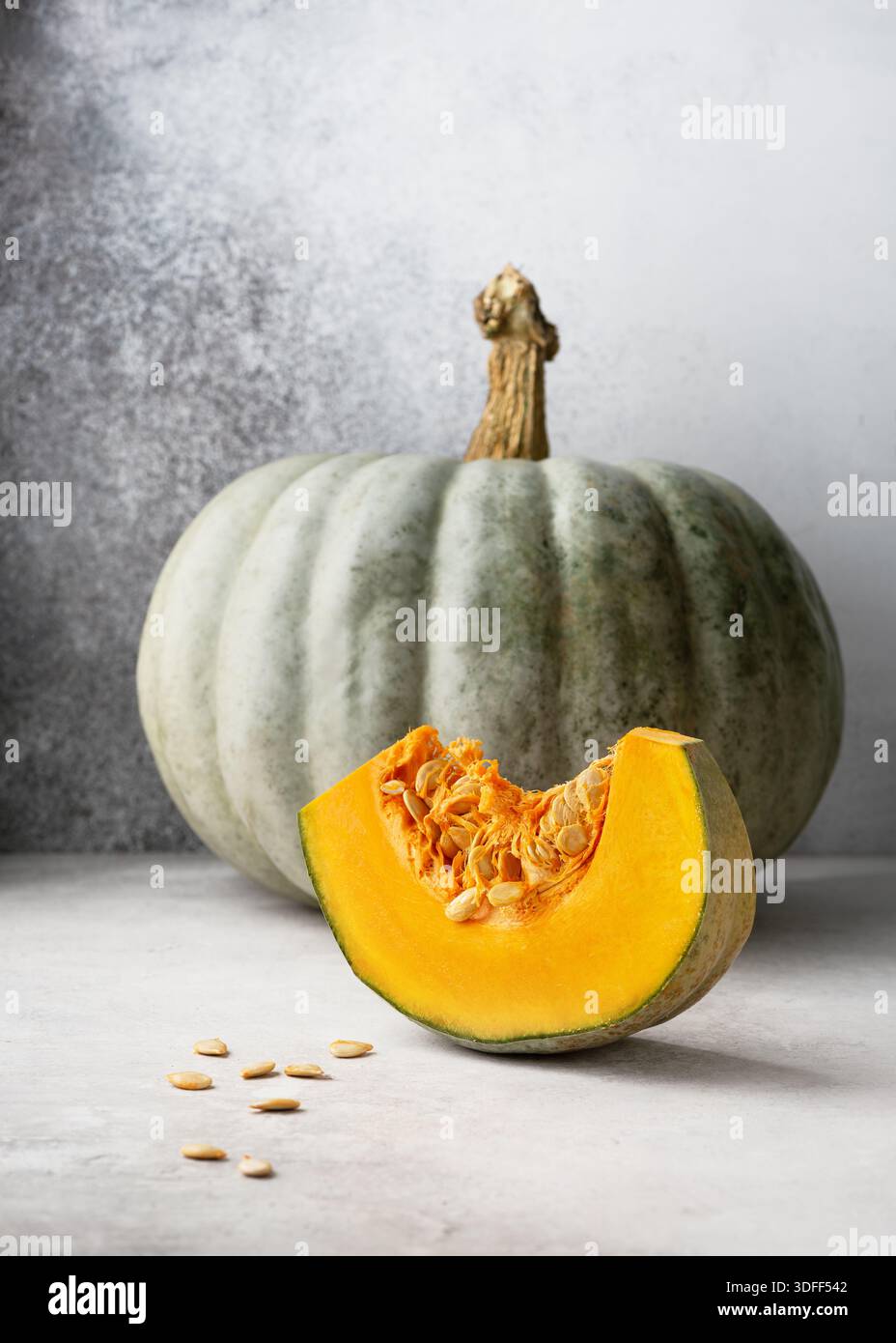Whole and sliced "Crown Prince" squash, pumpkin (Cucurbita maxima ...