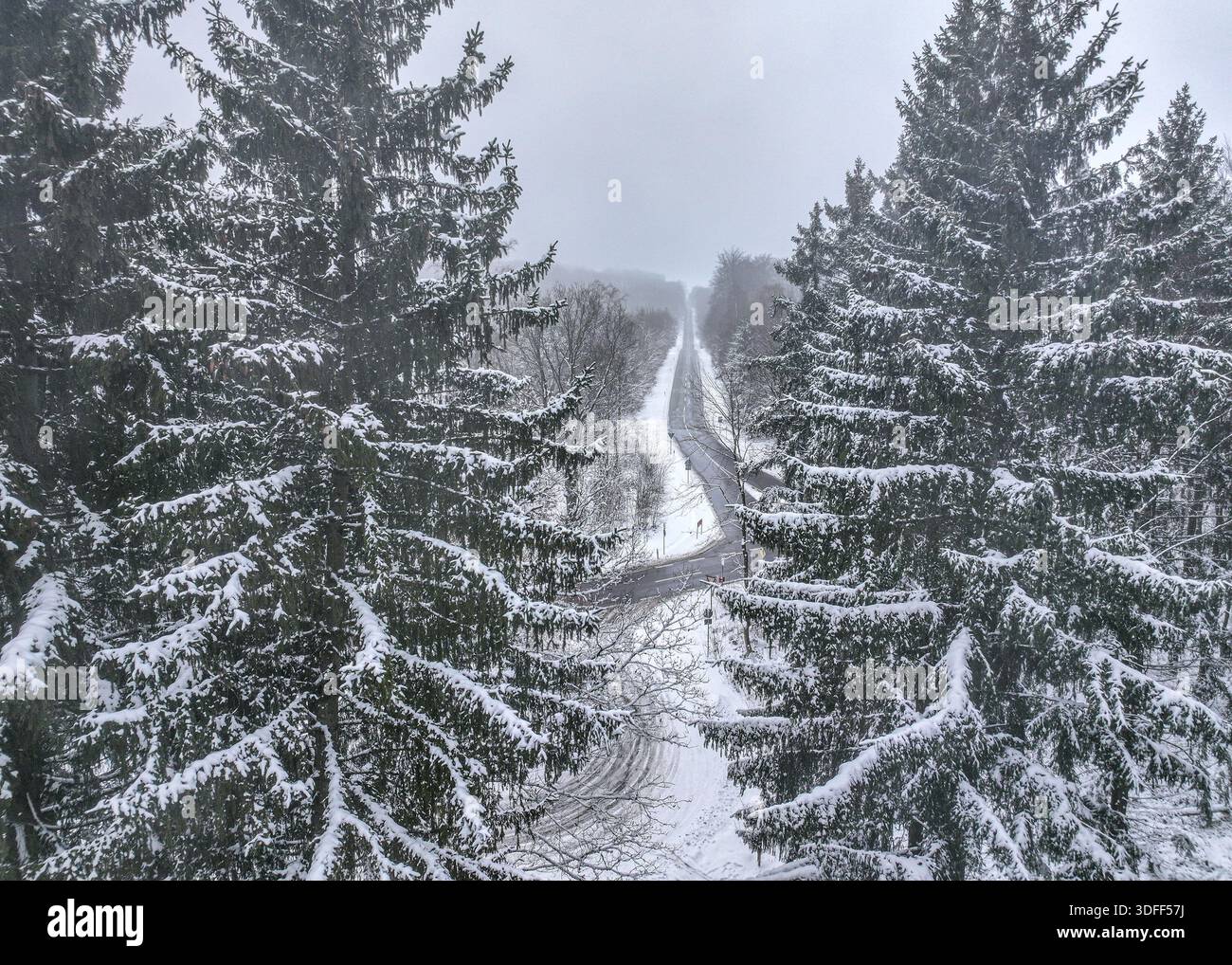 12 January 2026, Baden-Württemberg, Aalen: Snow-covered forests and ...