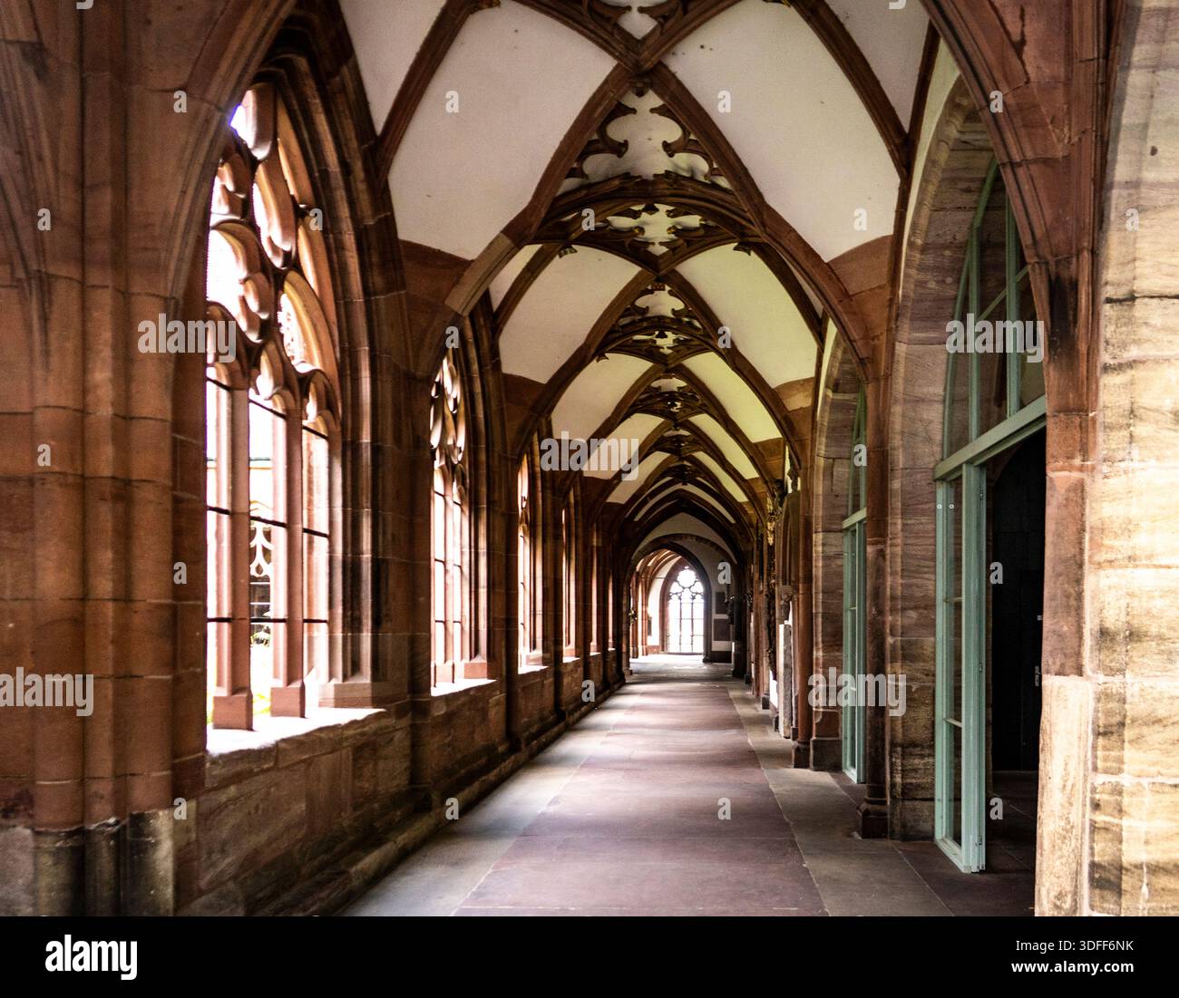Gothic-style cloister with arched windows and vaulted ceiling Stock ...