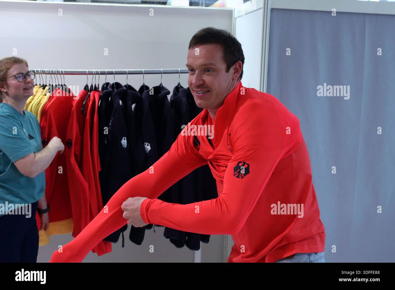 MUENCHEN, GERMANY- JANUARY 12: Loch Felix (luge) put on his shirt at ...
