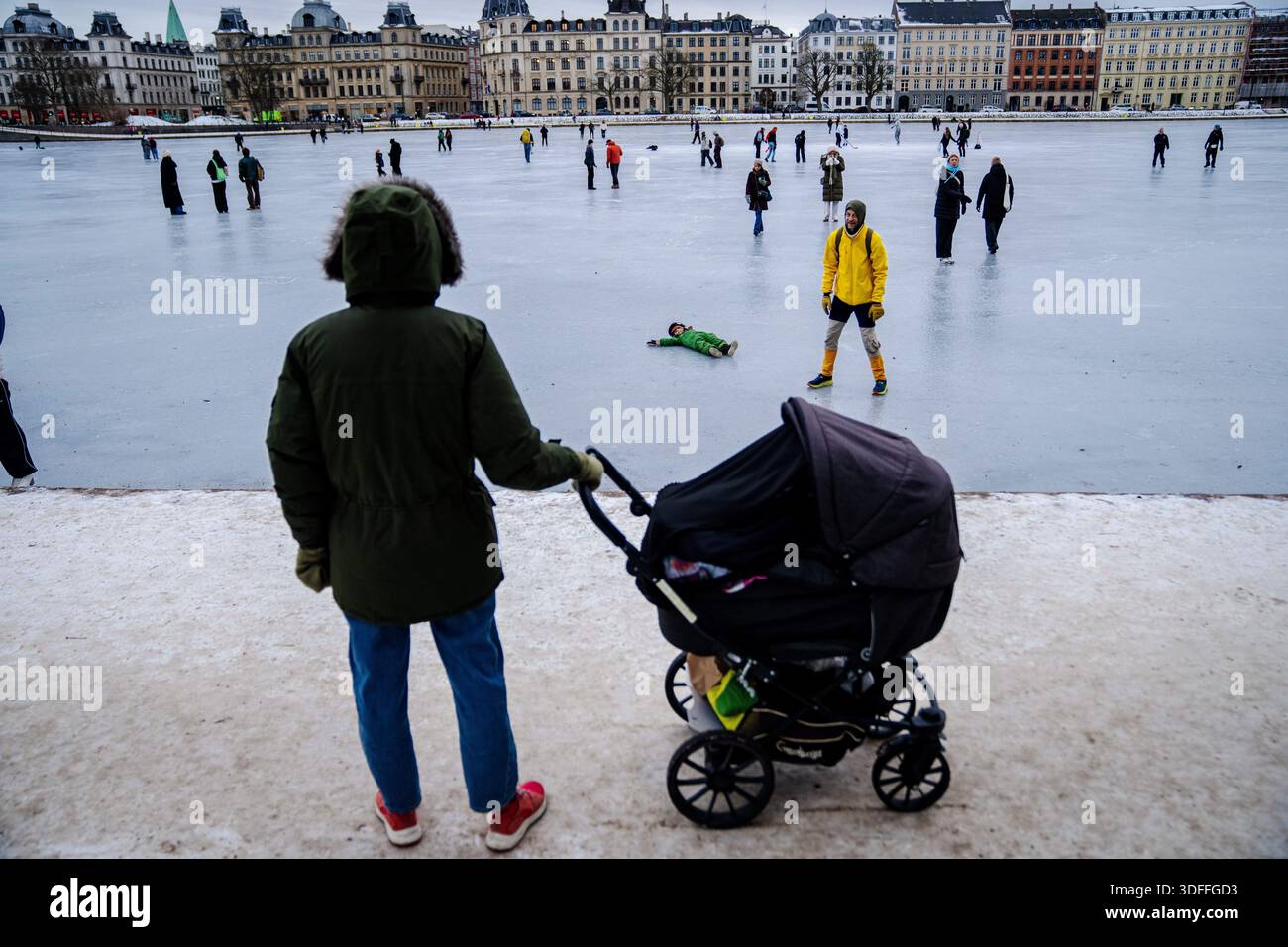 People walk on the frozen Lakes in Copenhagen, Denmark, Monday, Jan. 12 ...