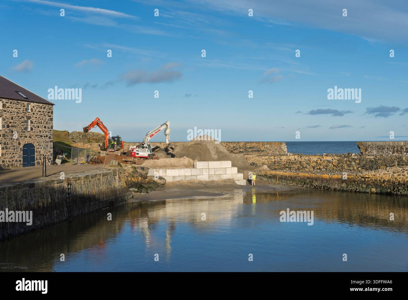 Workers are using JCB diggers to repair Portsoy Harbour in ...