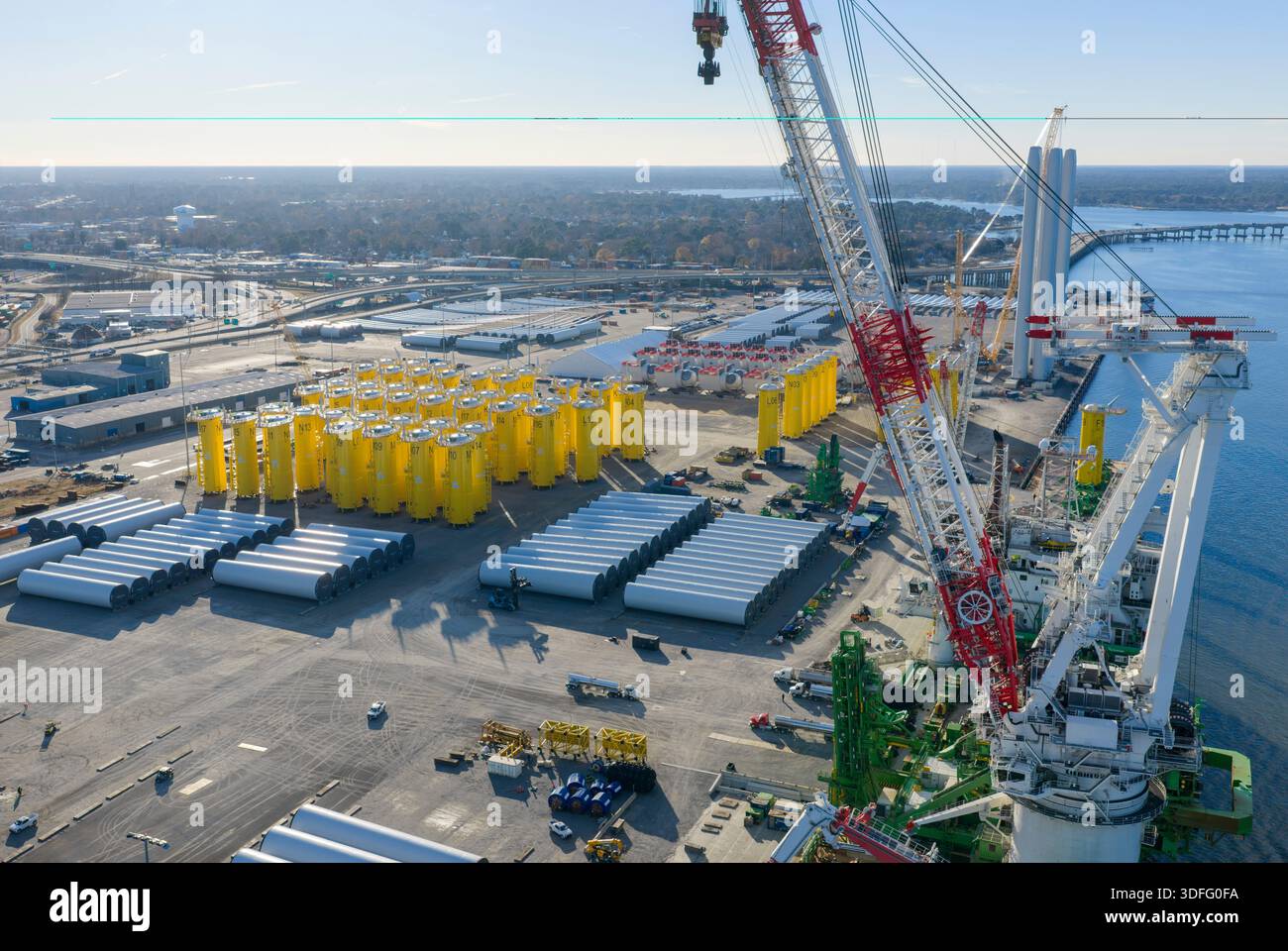 FILE - Wind turbine bases, generators and blades sit along with support ...