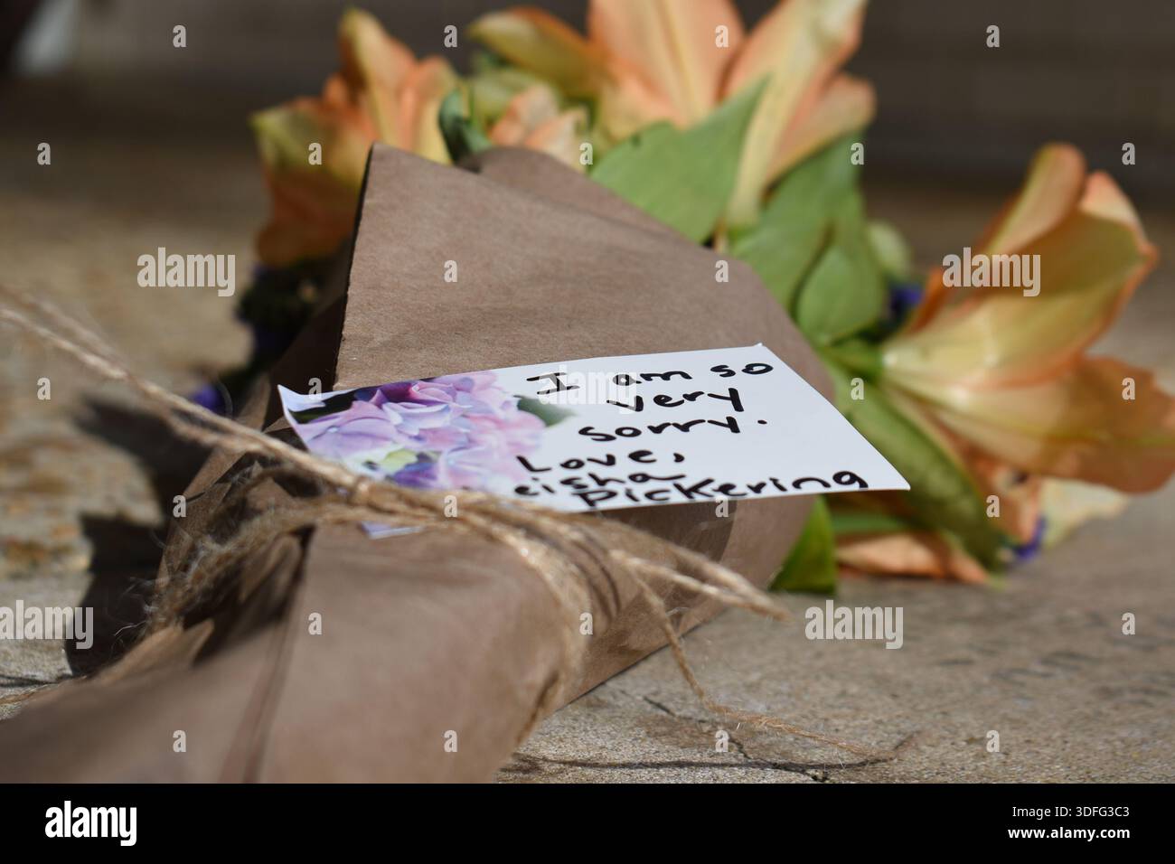 A note attached to a bundle of flowers left outside the Beth Israel ...