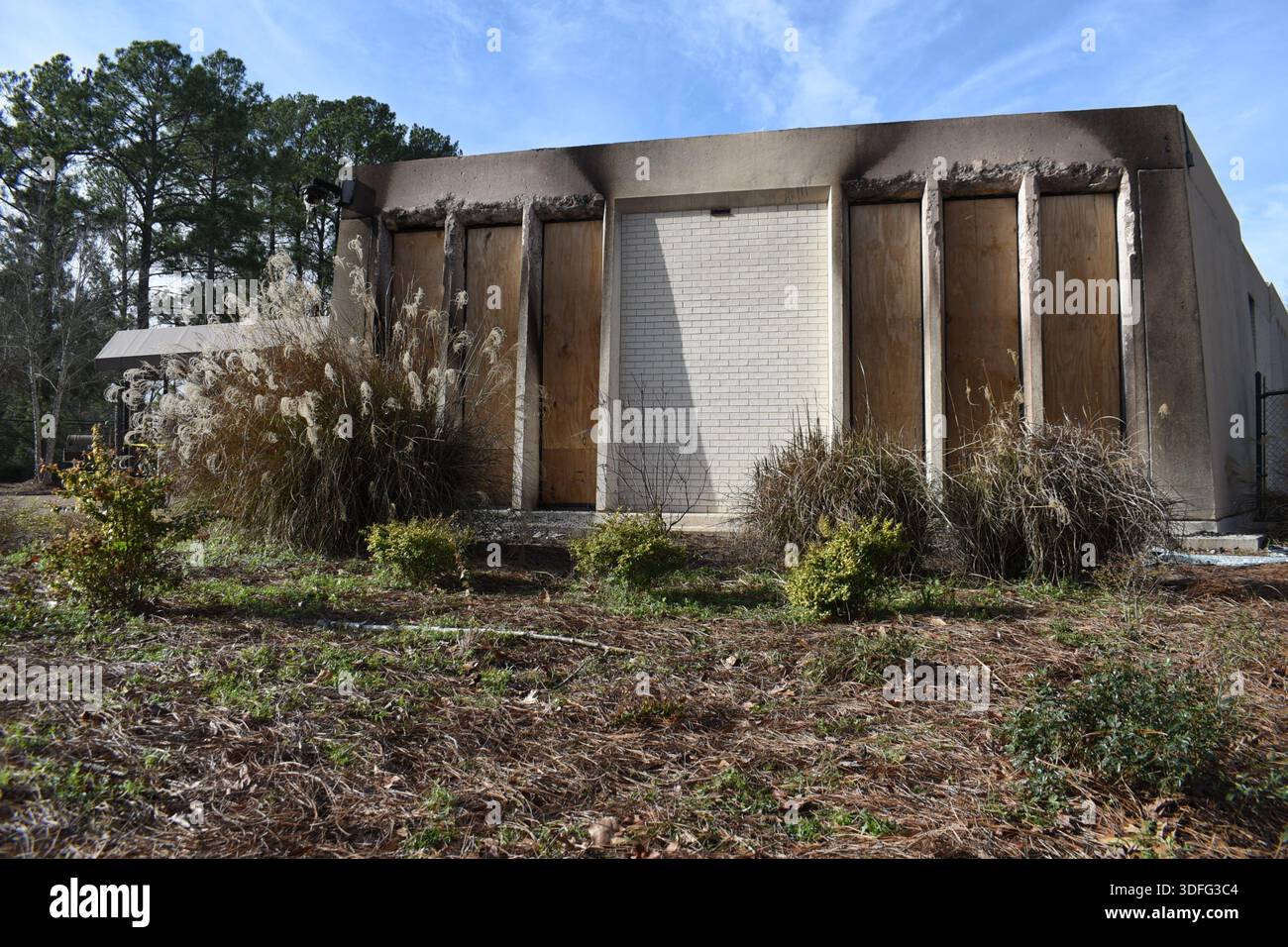Boards cover the charred remains of the Beth Israel Congregation ...