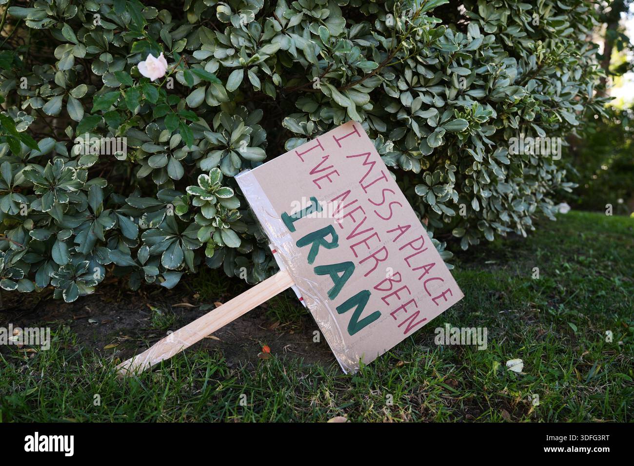 Signs from a Sunday protest, supporting protesters in Iran, are left on ...