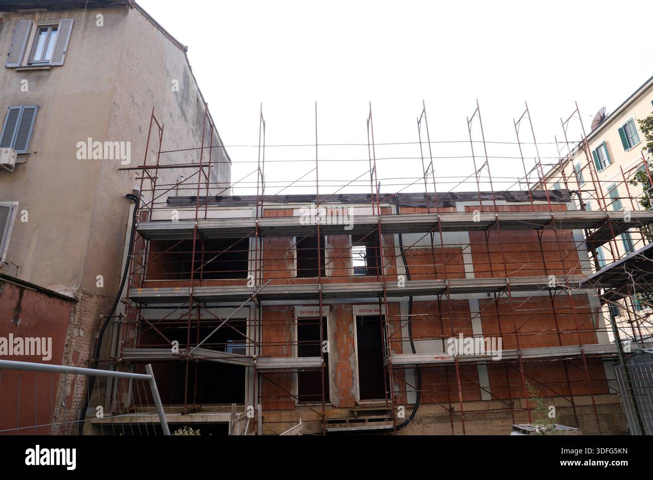 Milan, a building under construction in the courtyard is blocked by the ...