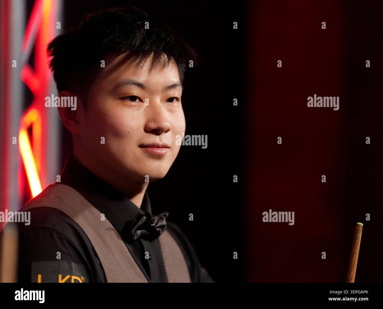 Zhao Xintong waits to enter the arena to play Gary Wilson (not in ...