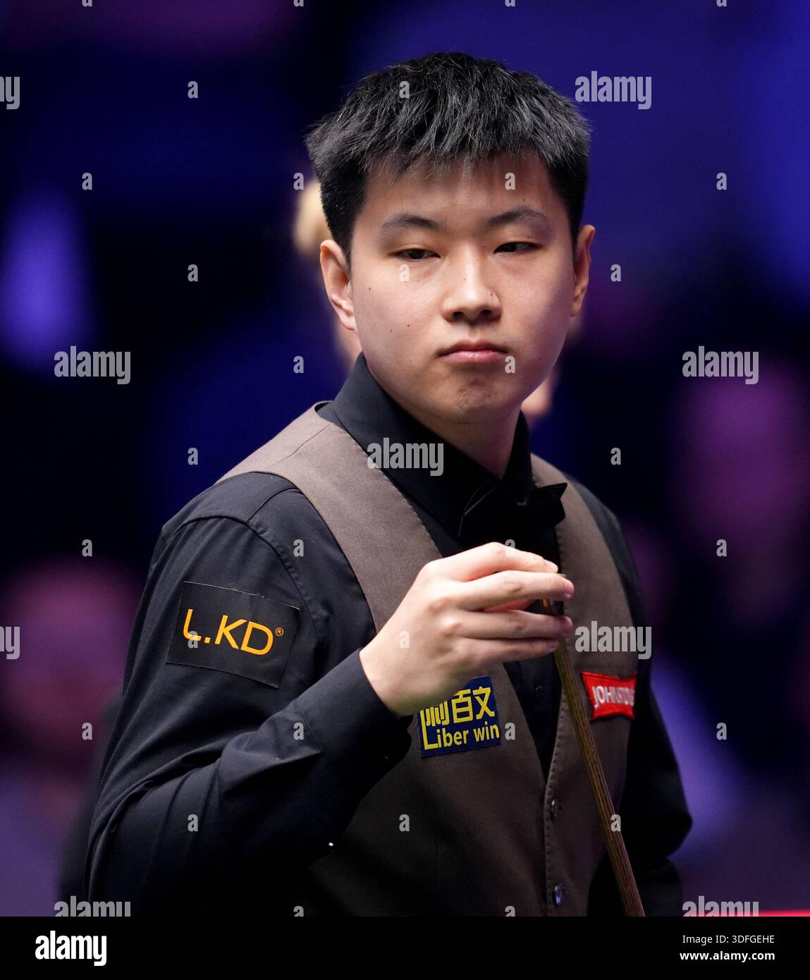 Zhao Xintong in action against Gary Wilson (not in picture)on day two ...