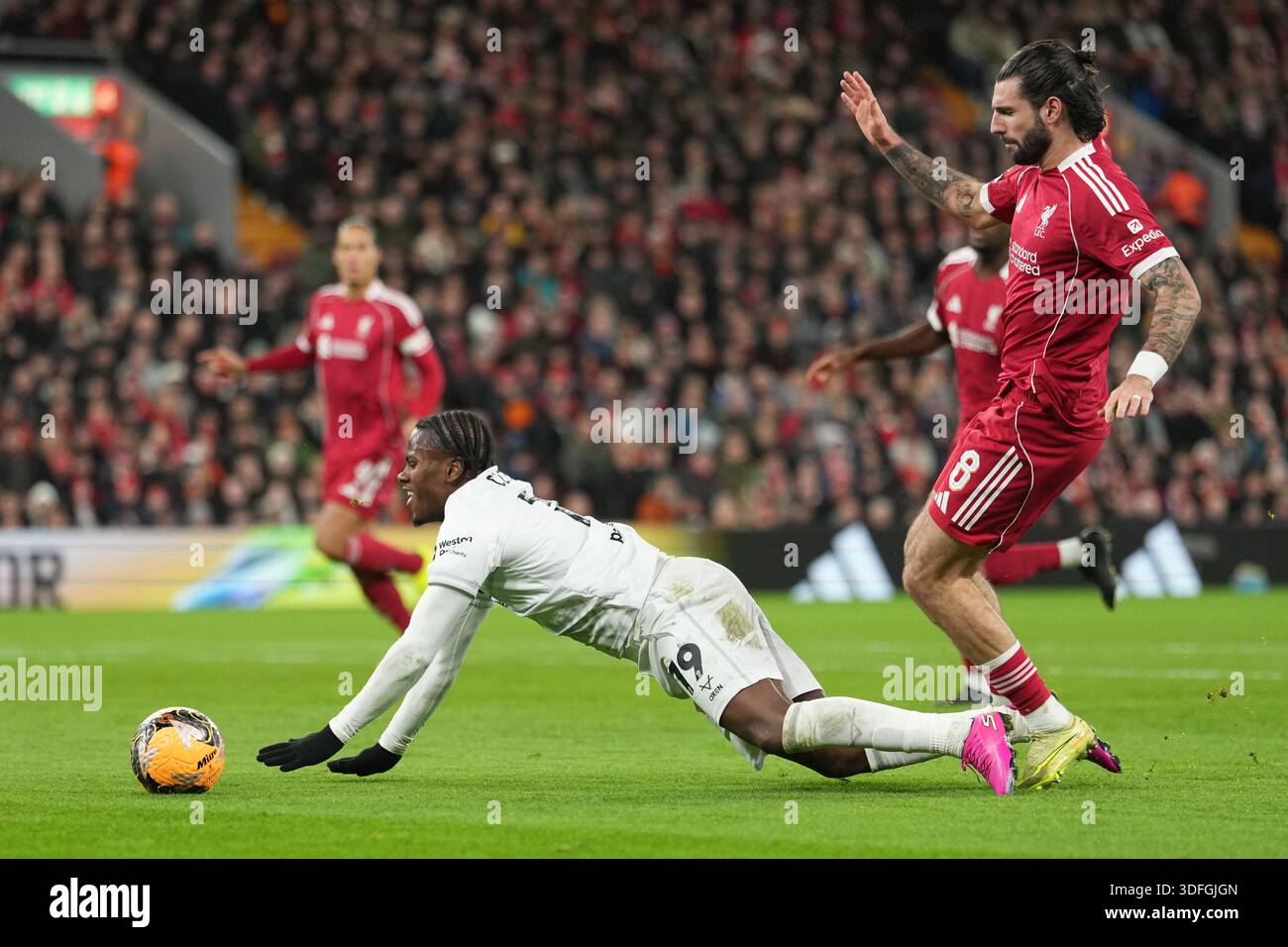 Barnsley's Reyes Cleary falls in front of Liverpool's Dominik ...