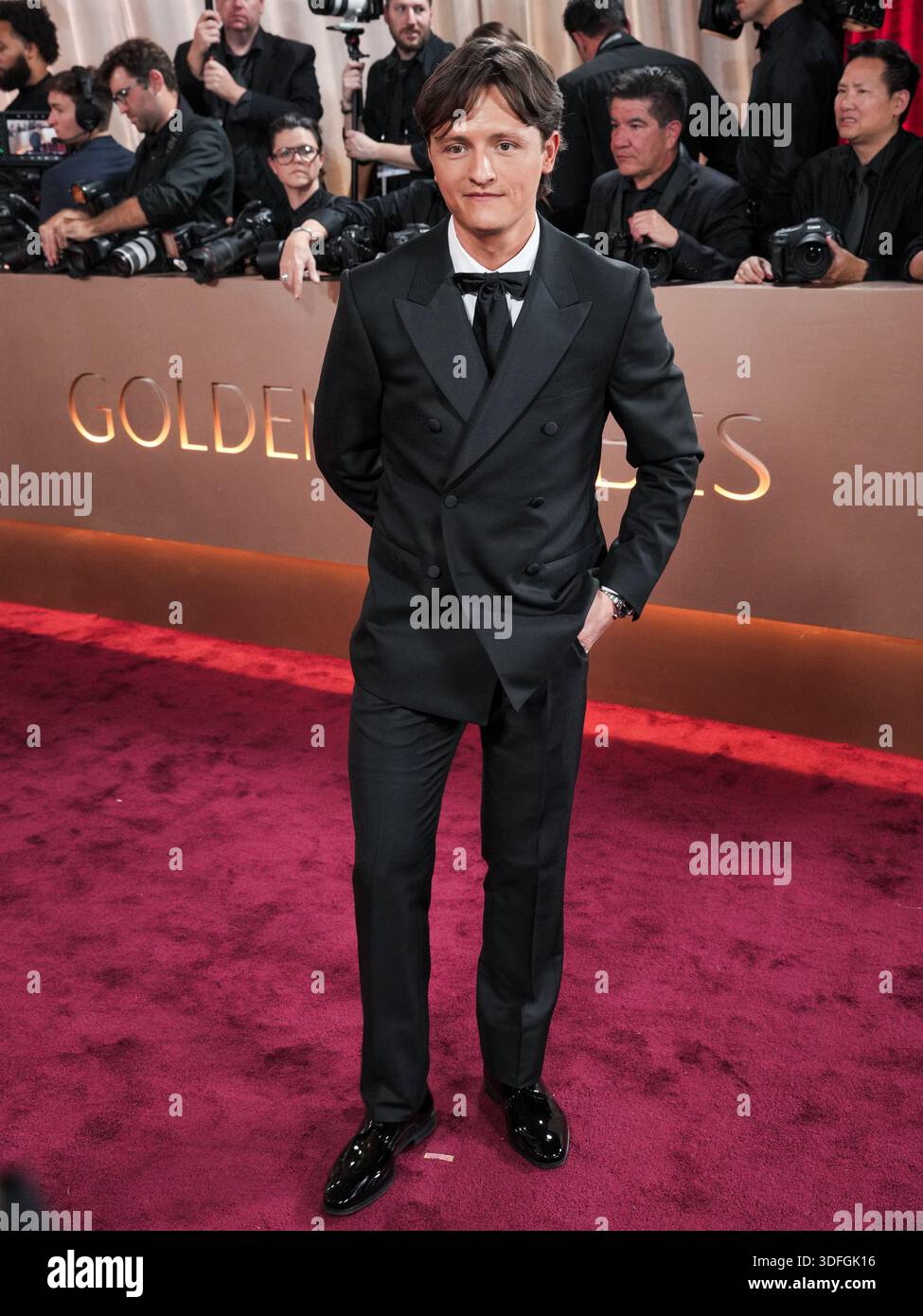 Connor Wood walking on the red carpet at The 83rd Annual Golden Globe ...