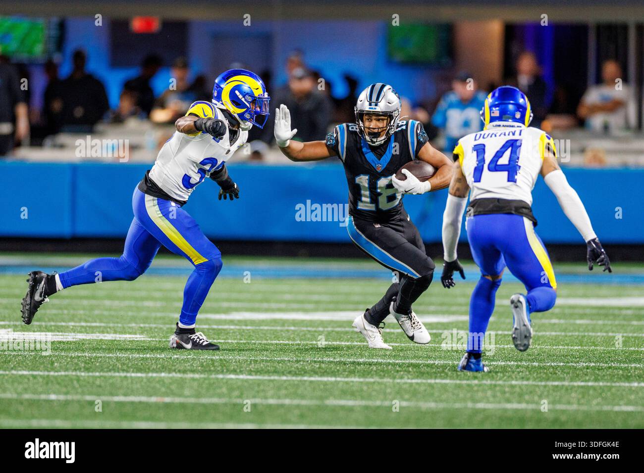 Carolina Panthers wide receiver Jalen Coker (18) attempts to avoid the ...