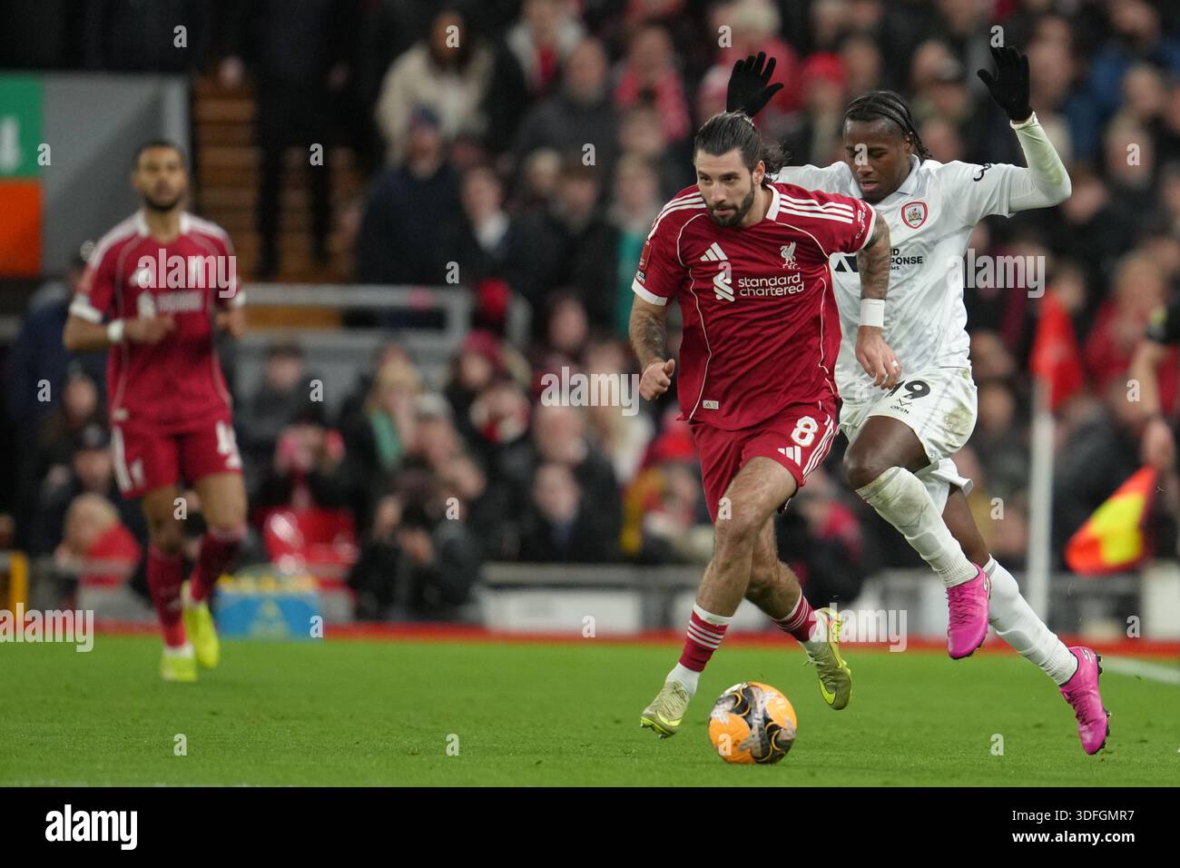 Barnsley's Reyes Cleary runs after Liverpool's Dominik Szoboszlai ...