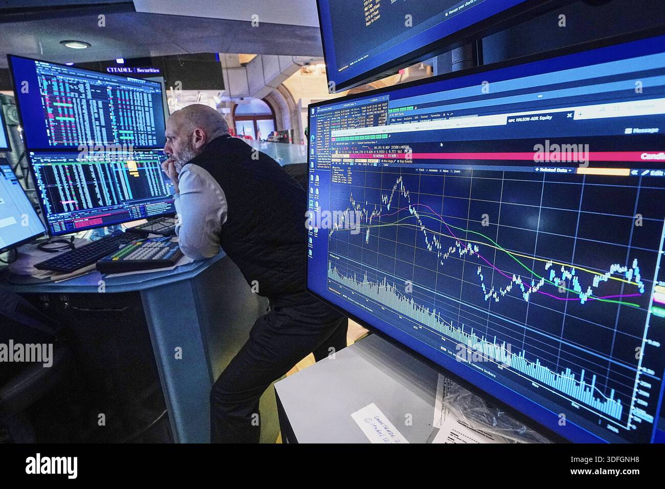 Specialist Meric Greenbaum works at his post on the floor of the New ...