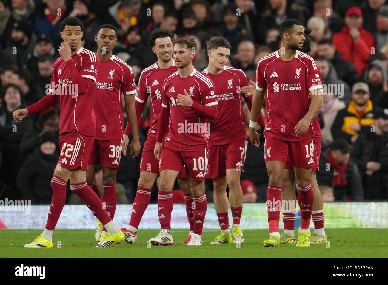 Liverpool players walk to the ceneter after scoring during the FA Cup ...