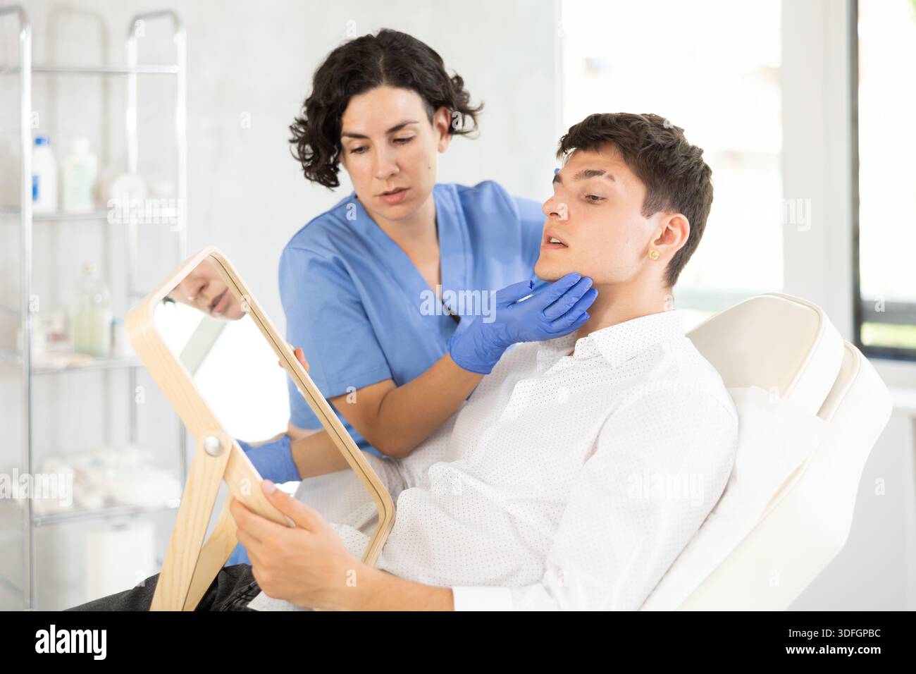male patient with mirror Stock Photo - Alamy