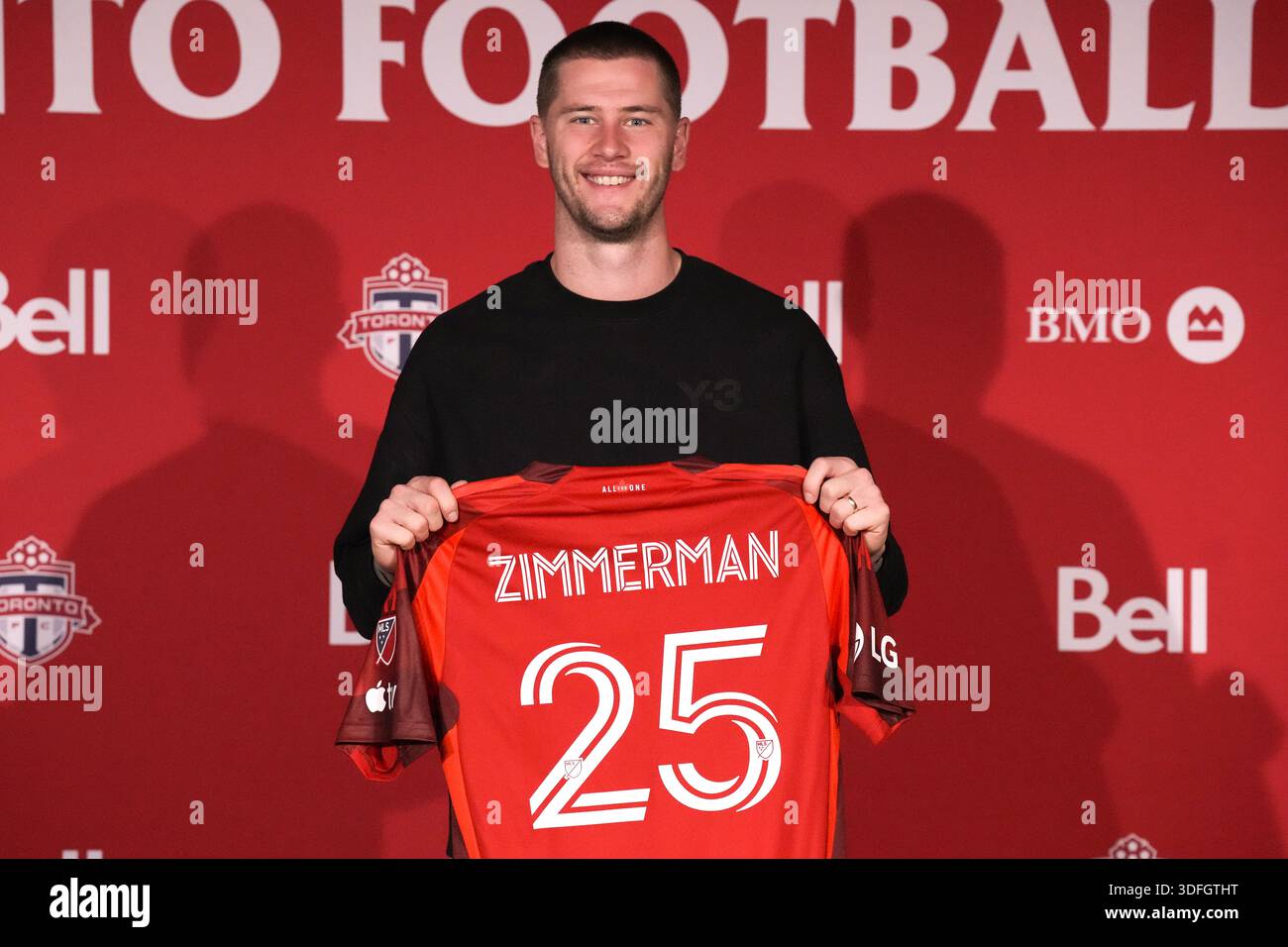 Walker Zimmerman holds a Toronto FC shirt bearing his name, at a news ...