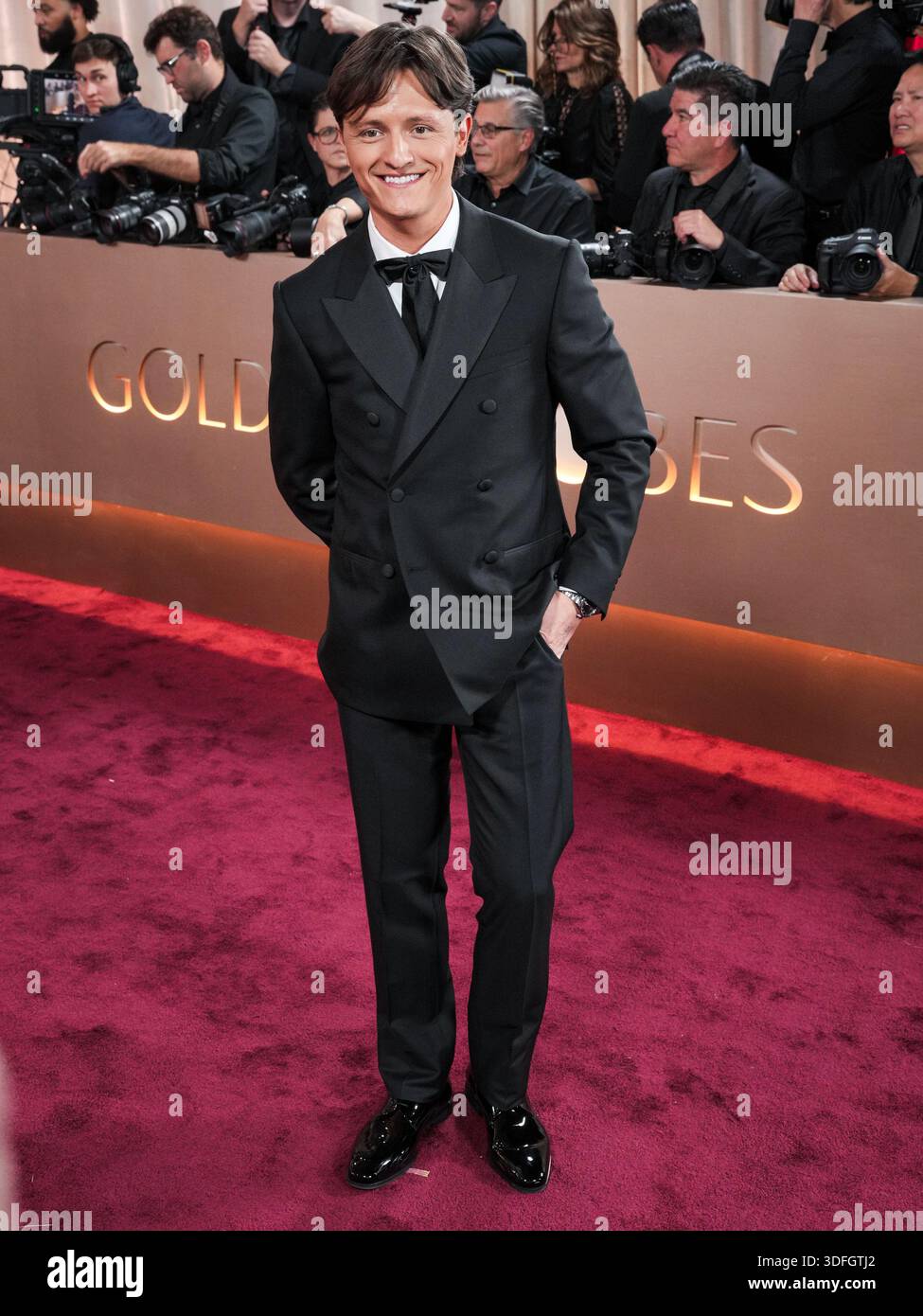Connor Wood walking on the red carpet at The 83rd Annual Golden Globe ...
