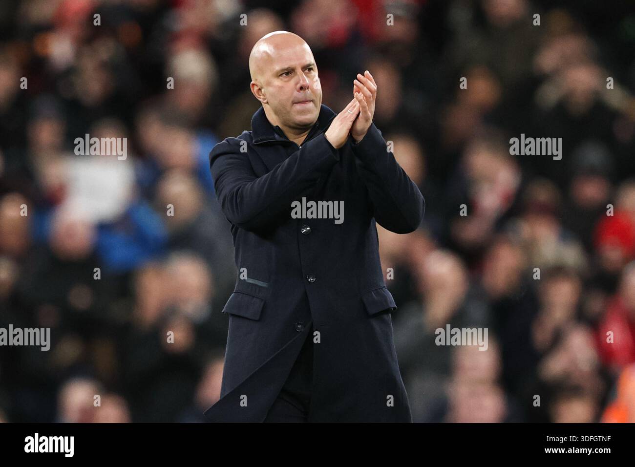 Arne Slot manager of Liverpool applauds the fans after the game in the ...