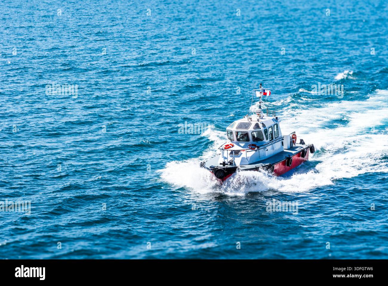 Pilot boat underway at sea, transporting harbor pilot for ship ...