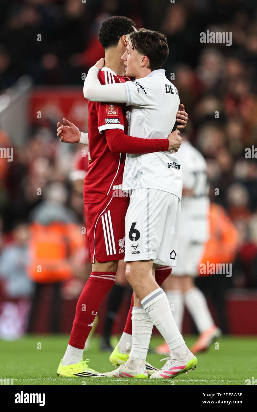 Hugo Ekitike of Liverpool embraces Mael de Gevigney of Barnsley after ...
