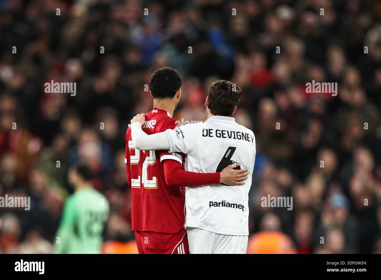 Hugo Ekitike of Liverpool embraces Mael de Gevigney of Barnsley after ...